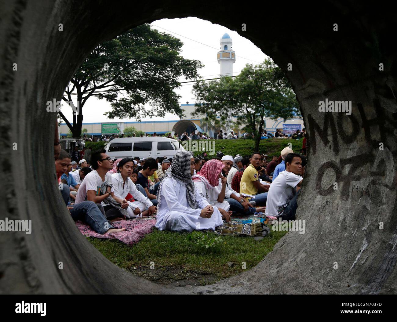 Filipino Muslims attend a prayer at the Blue Mosque to mark the ...