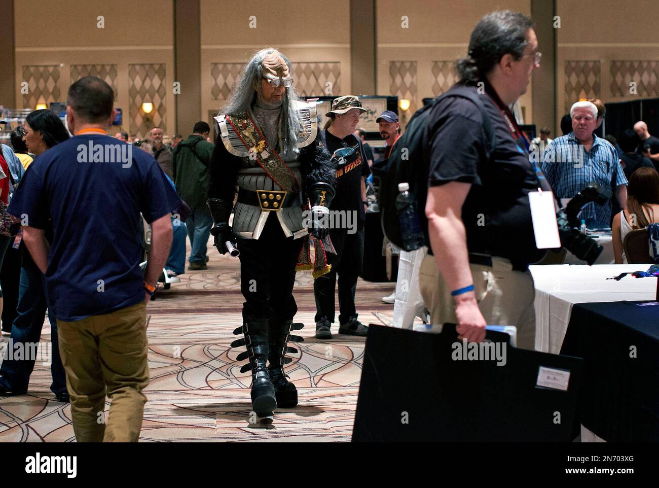 John Stephan, dressed as a Klingon, walks through the exhibition hall ...