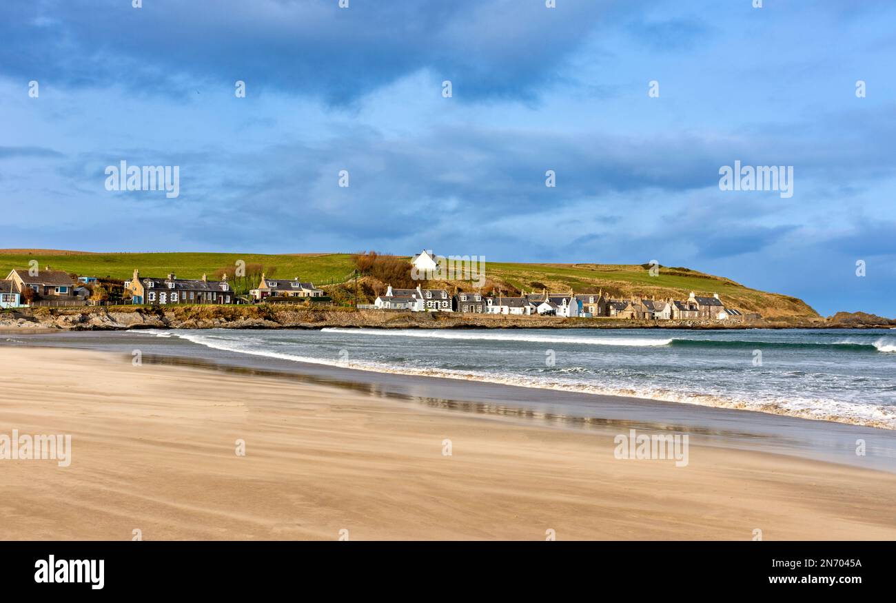 Sandend Village Aberdeenshire Scotland houses and wind swept waves and ...