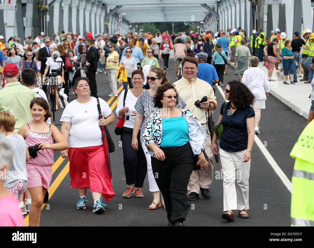 Hundreds of people get a chance to walk across the newly re-opened ...