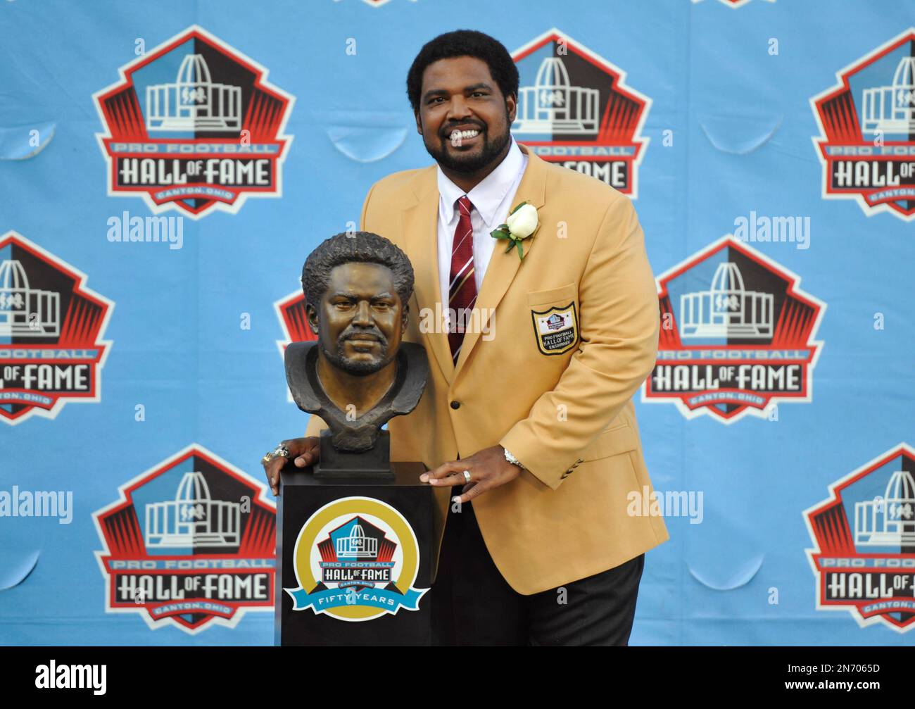 Inductee Jonathan Ogden poses with his bust during the induction ...