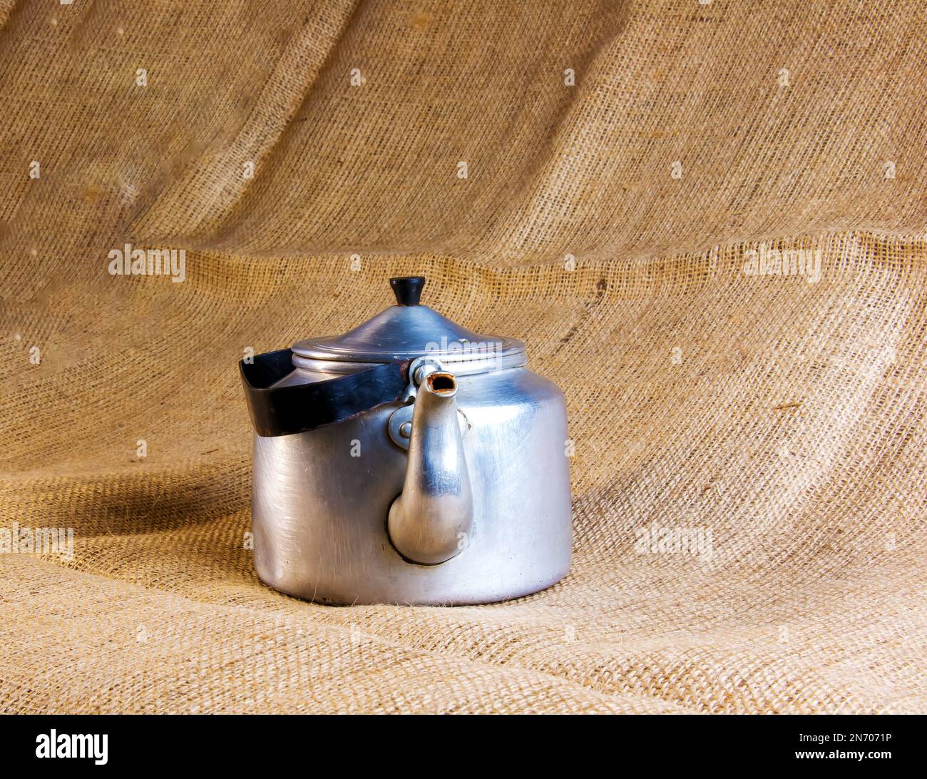 An old soldier's aluminum teapot from the Second World War against the ...