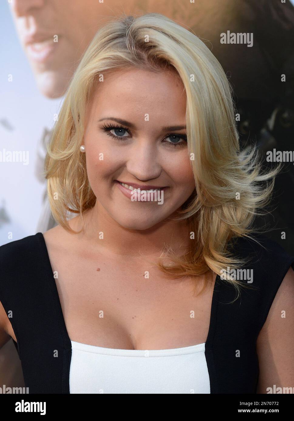 Actress Emily Osment arrives at the world premiere of "Elysium" at the ...