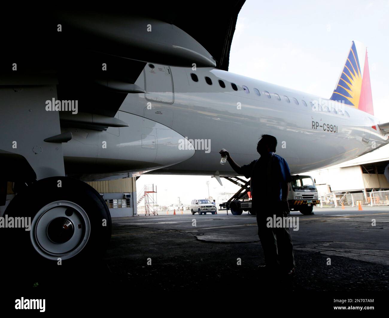 A Roman Catholic priest blesses with holy water the brand new Airbus ...