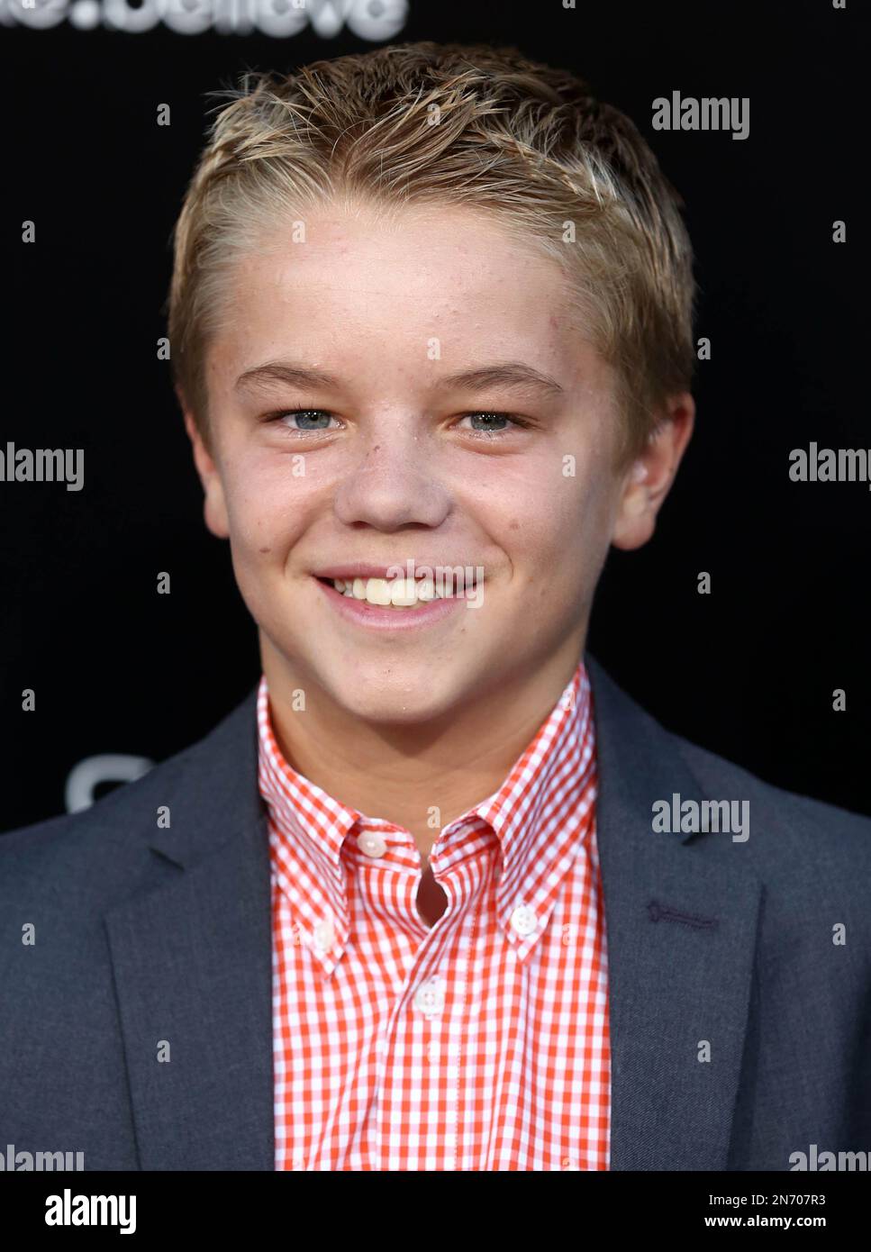 Maxwell Perry Cotton arrives at the world premiere of "Elysium" at the Regency Village Theater ...