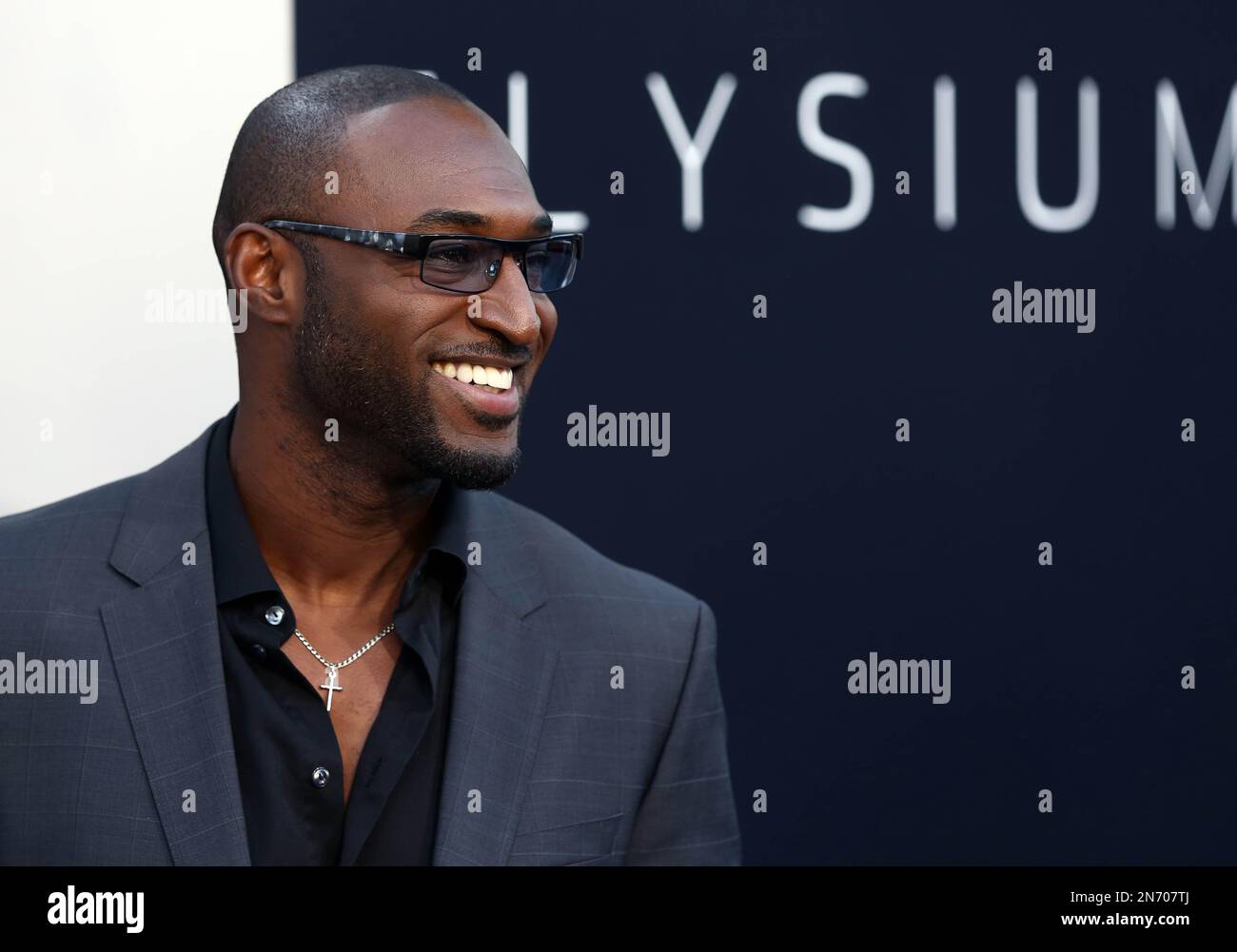 Adrian Holmes arrives at the world premiere of "Elysium" at the Regency ...