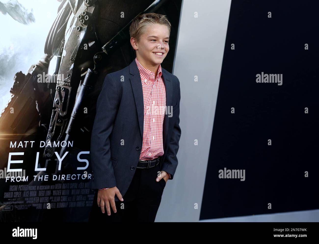 Maxwell Perry Cotton arrives at the world premiere of "Elysium" at the ...