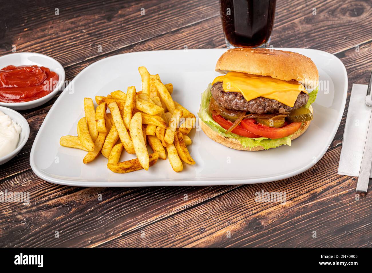 Cheeseburger with Tomatoes and Pickles with French Fries and Ketchup ...