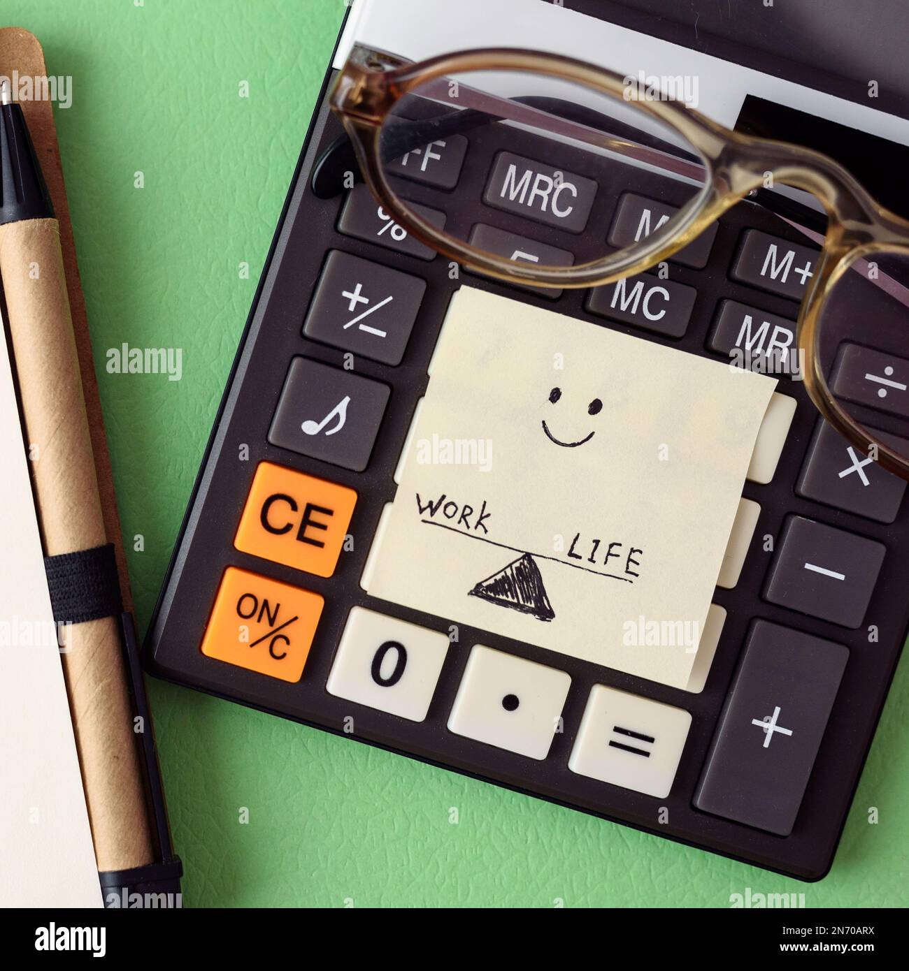 Work Life Balance - Finished work day concept: pen, glasses, calculator ...