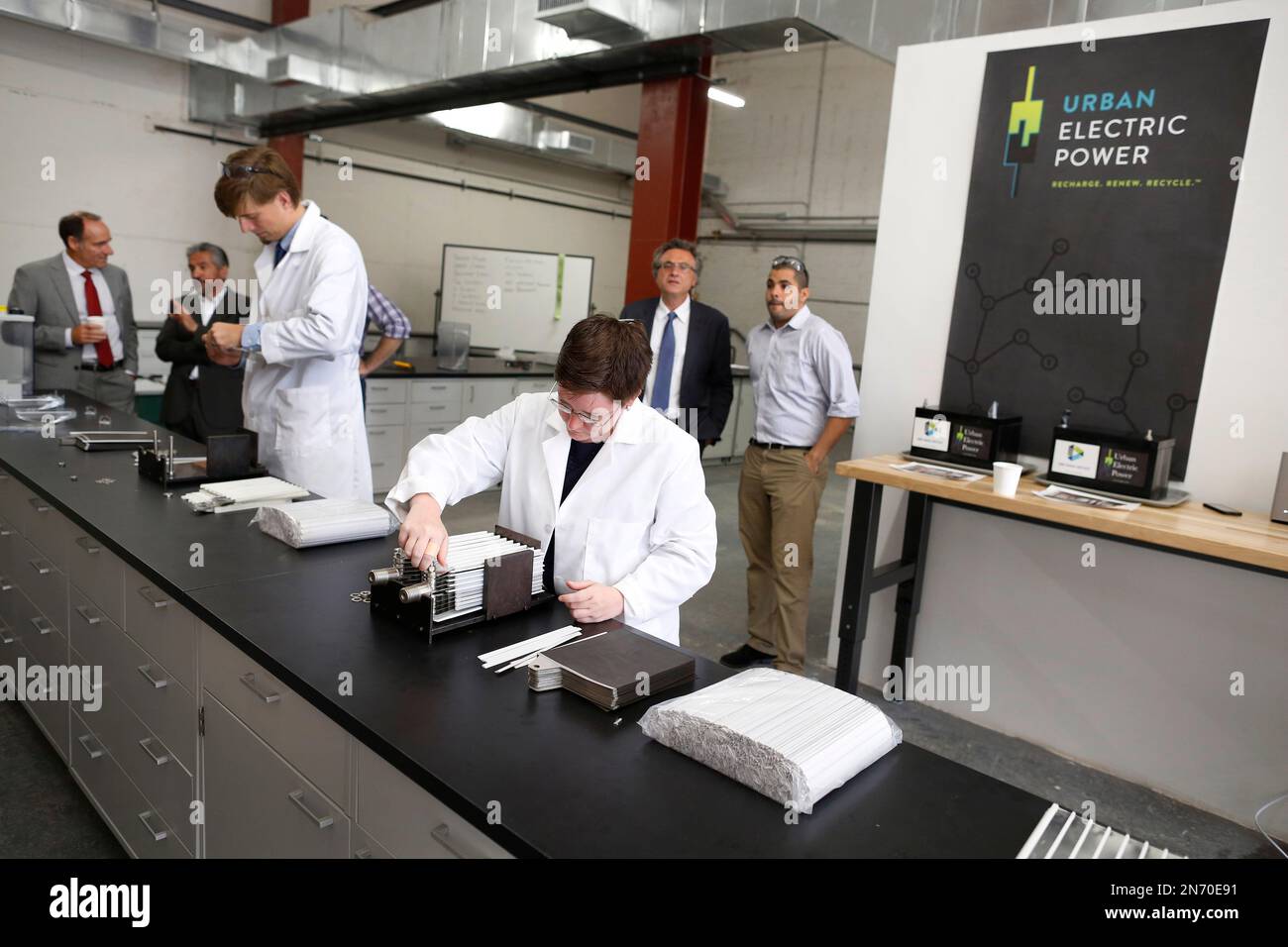 An engineer demonstrates the assembly of a battery after the Urban ...