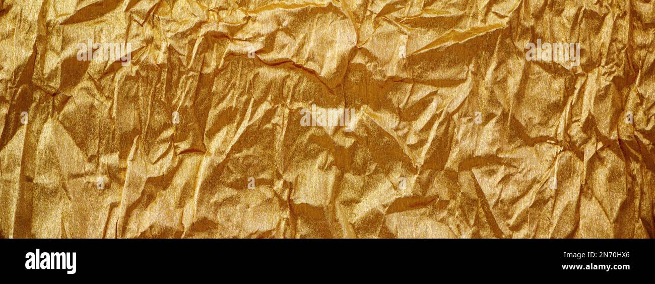 Golden banner background. crumpled gold paper textured Stock Photo - Alamy