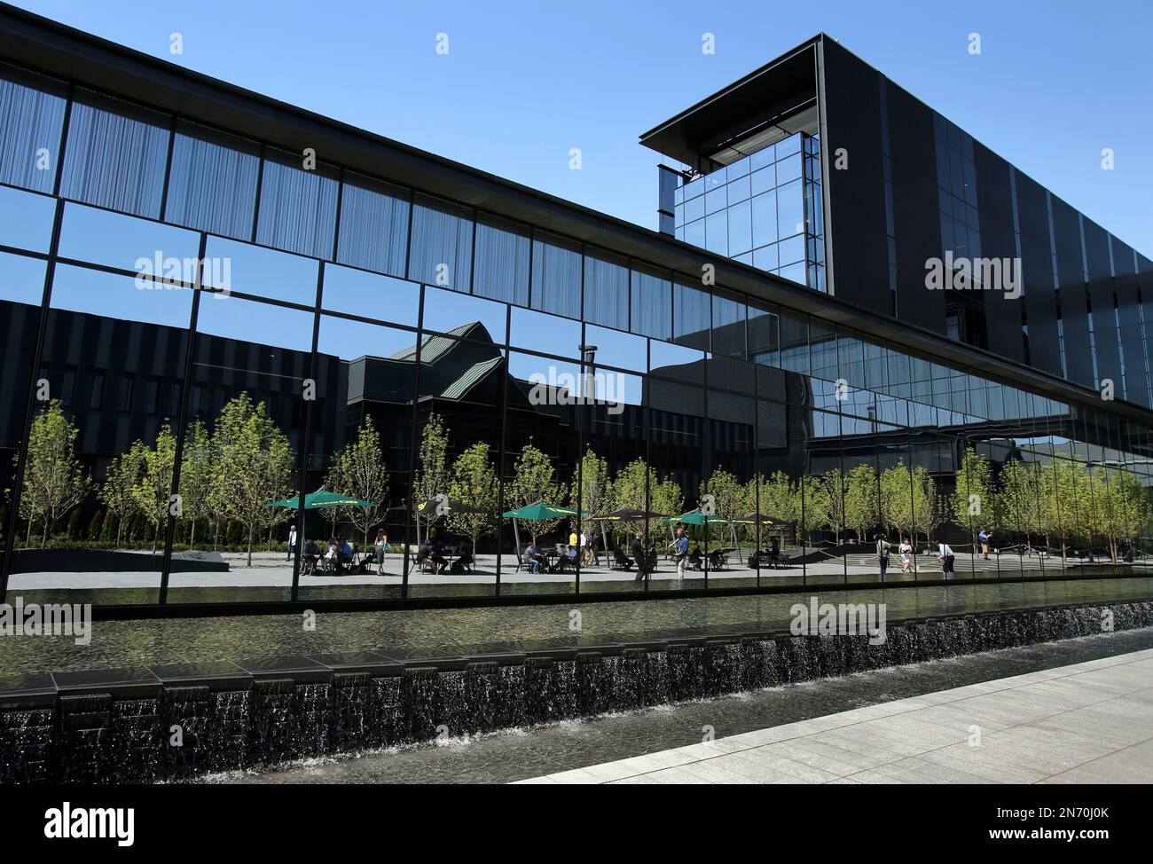 Water flows near a reflecting pool outside the new 145,000-square-foot ...