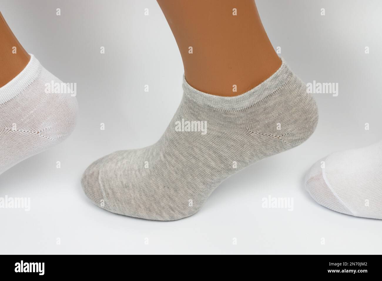 Socks on a white background. Socks on the leg Stock Photo - Alamy