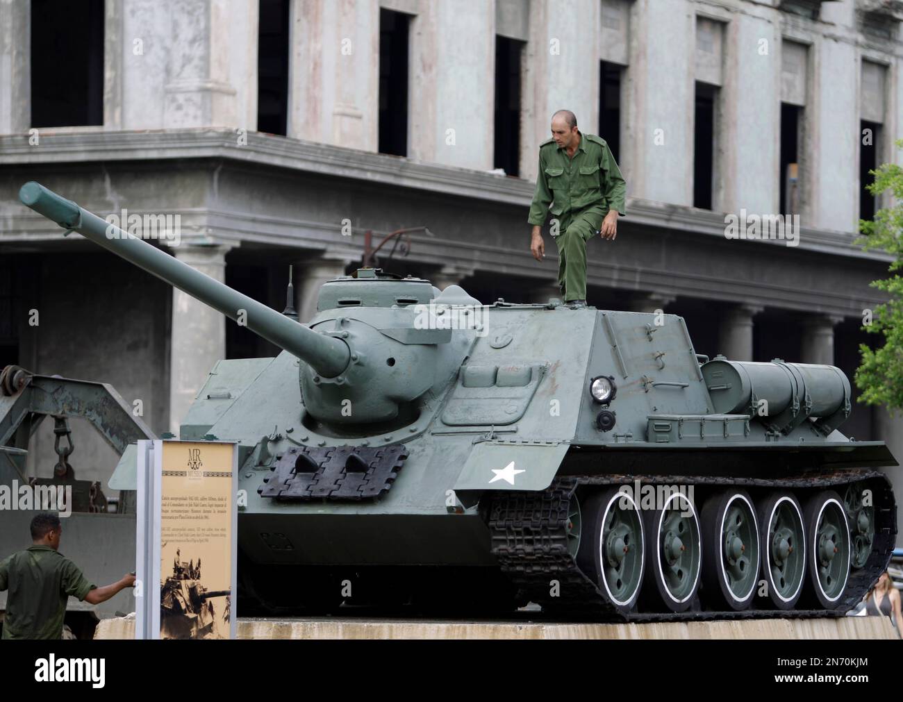 A soldier walks on the tank that was used by Fidel Castro in 1961 to ...
