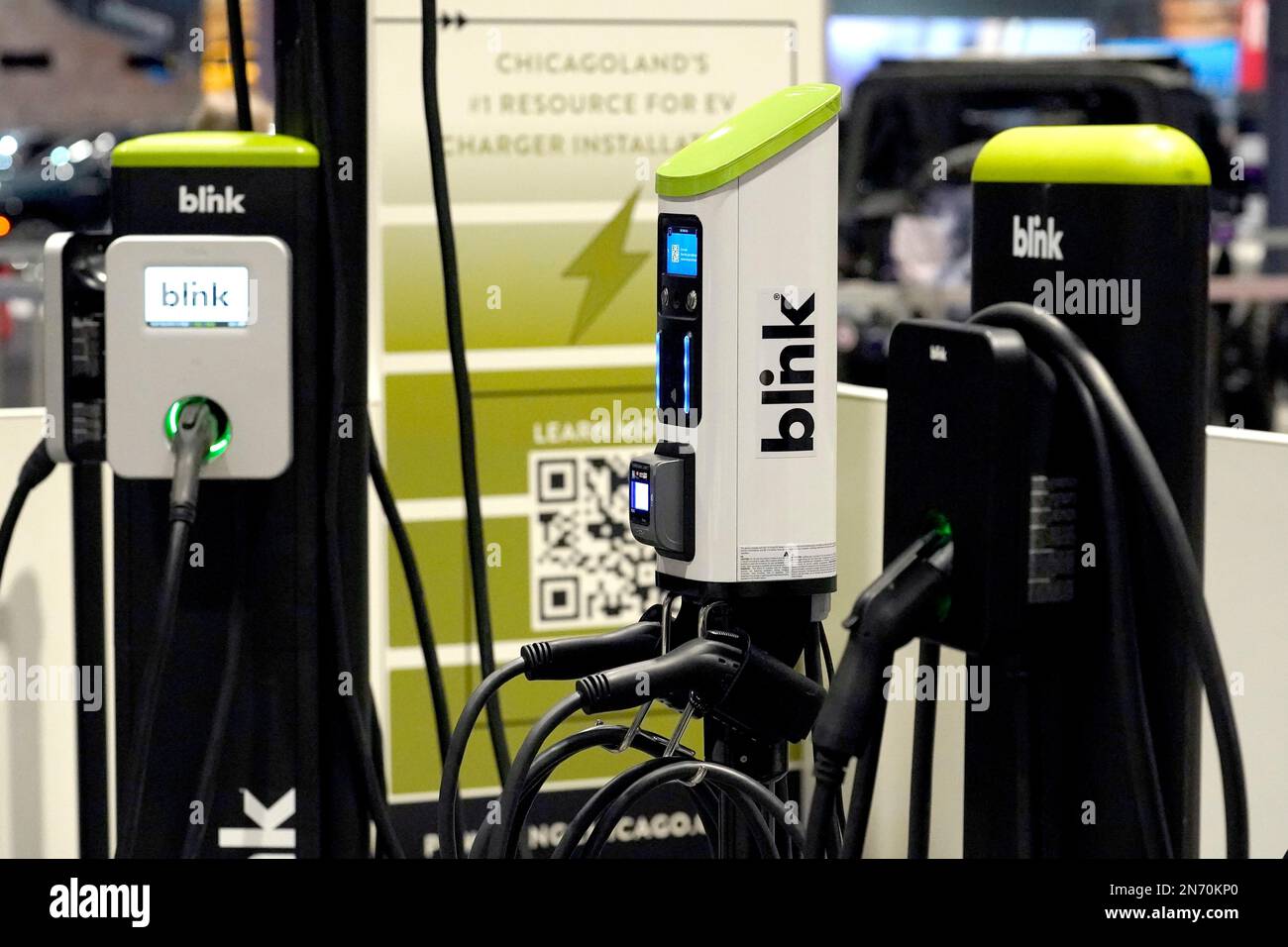 Three Blink electric vehicle charging stations sit on display at the ...
