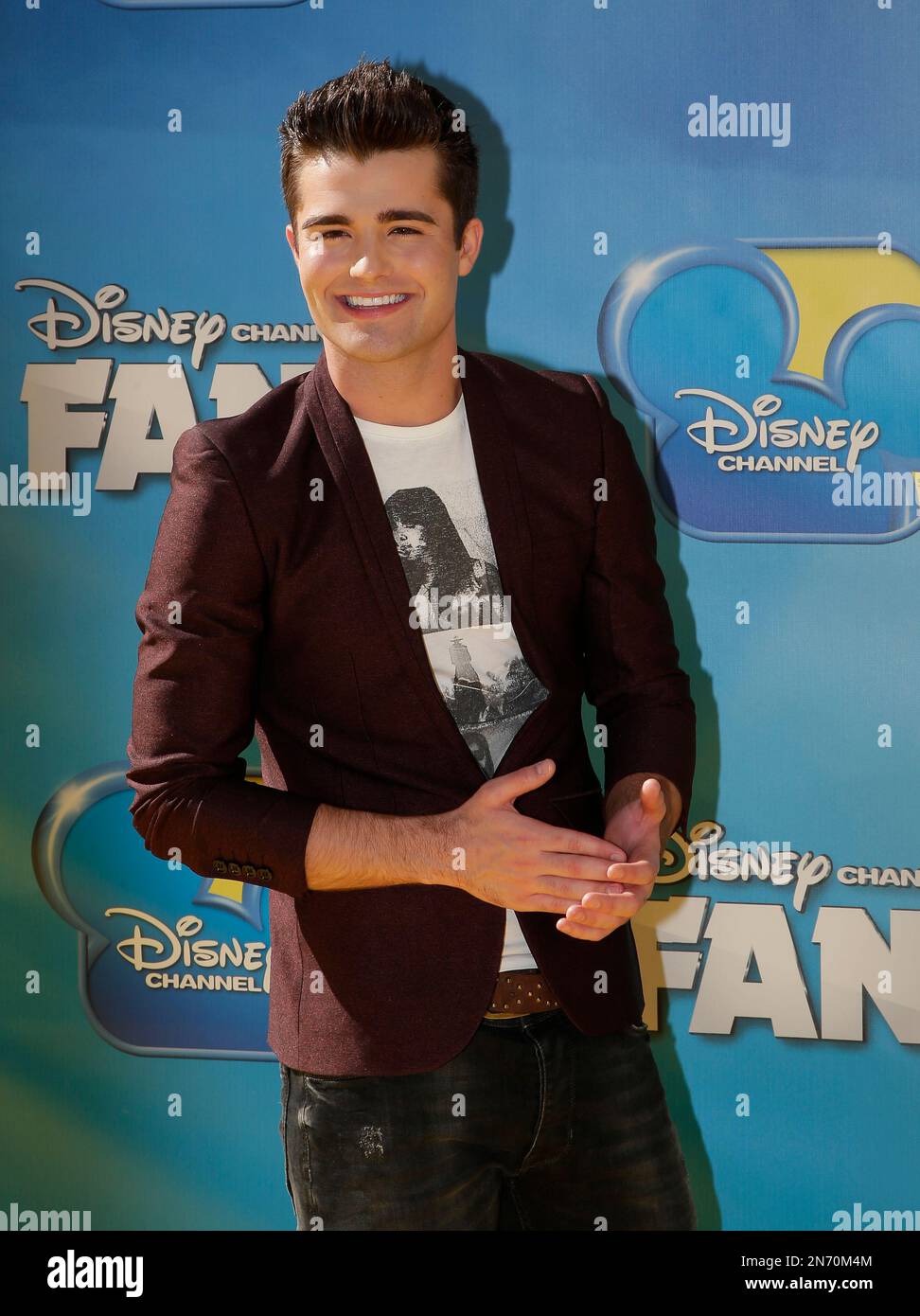 Disney star Spencer Boldman poses for a photo while walking on the red ...