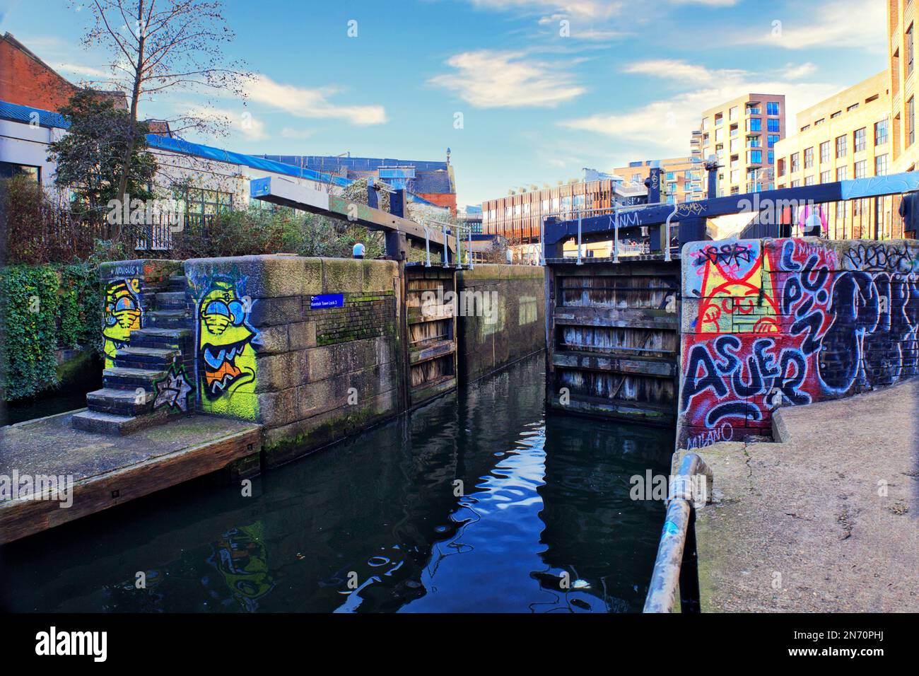 Colourful graffiti on Regent's Canal lock gates at Camden Town, London ...