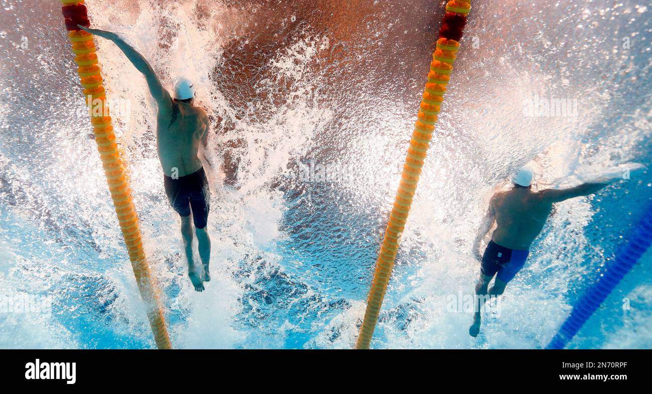 France's Camille Lacourt, left, and Israel's Guy Marcos Barnea, right ...