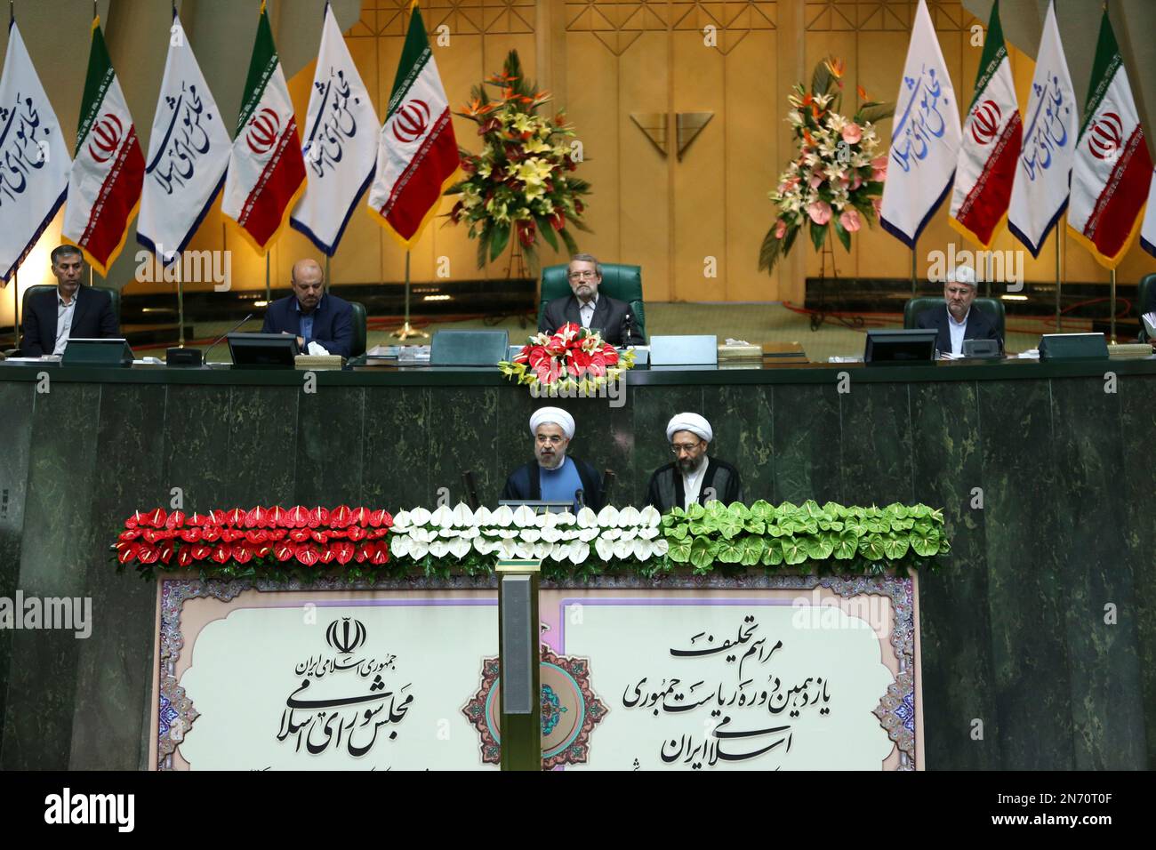 Iran's new President Hasan Rouhani, bottom left, swears-in as he stands ...