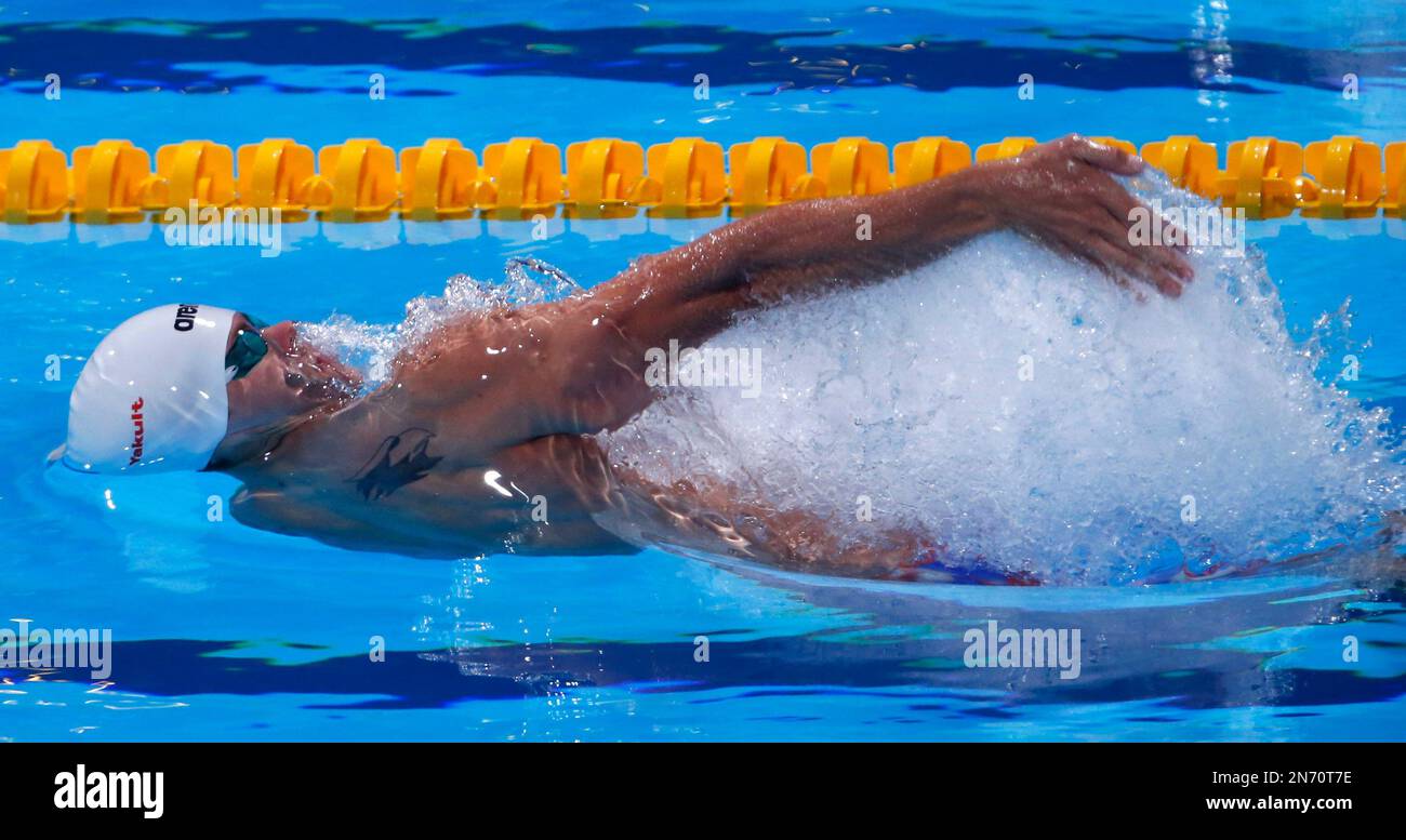 David Plummer of the United States swims the first leg in a Men's ...