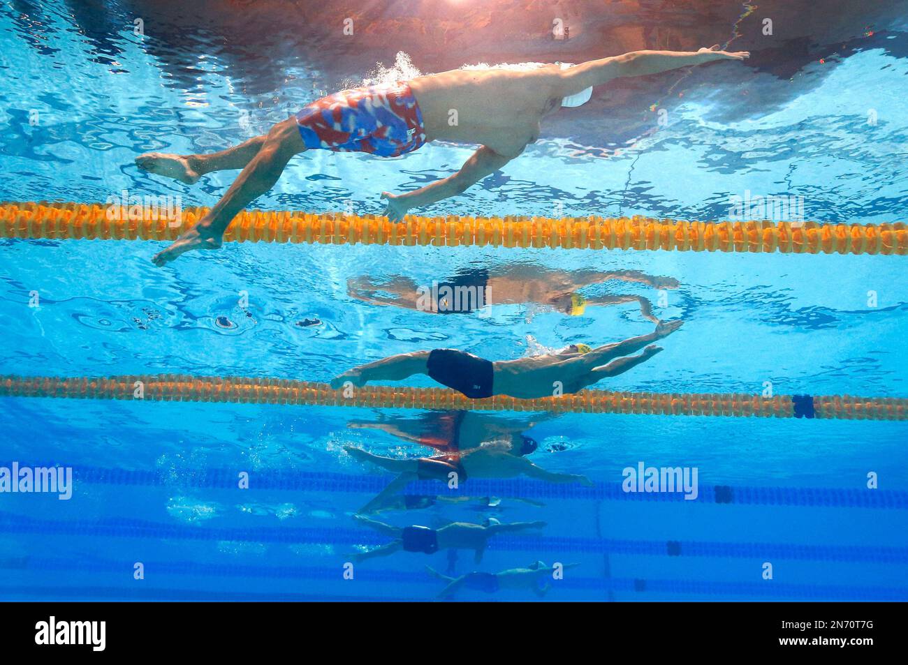 David Plummer of the United States, top, and Australia's Ashley Delaney ...