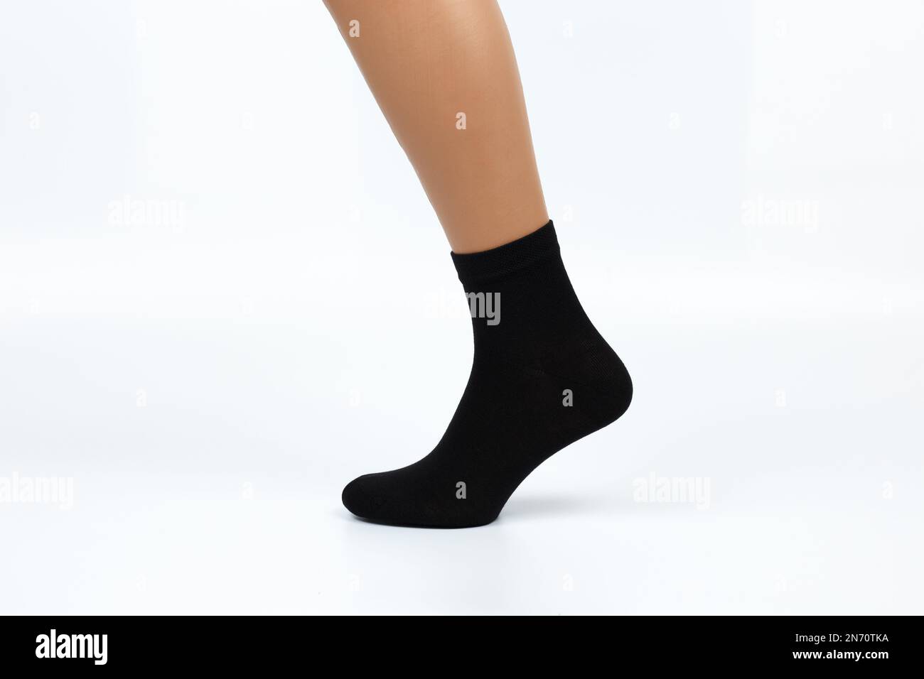 Socks on a white background. Socks on the leg Stock Photo - Alamy