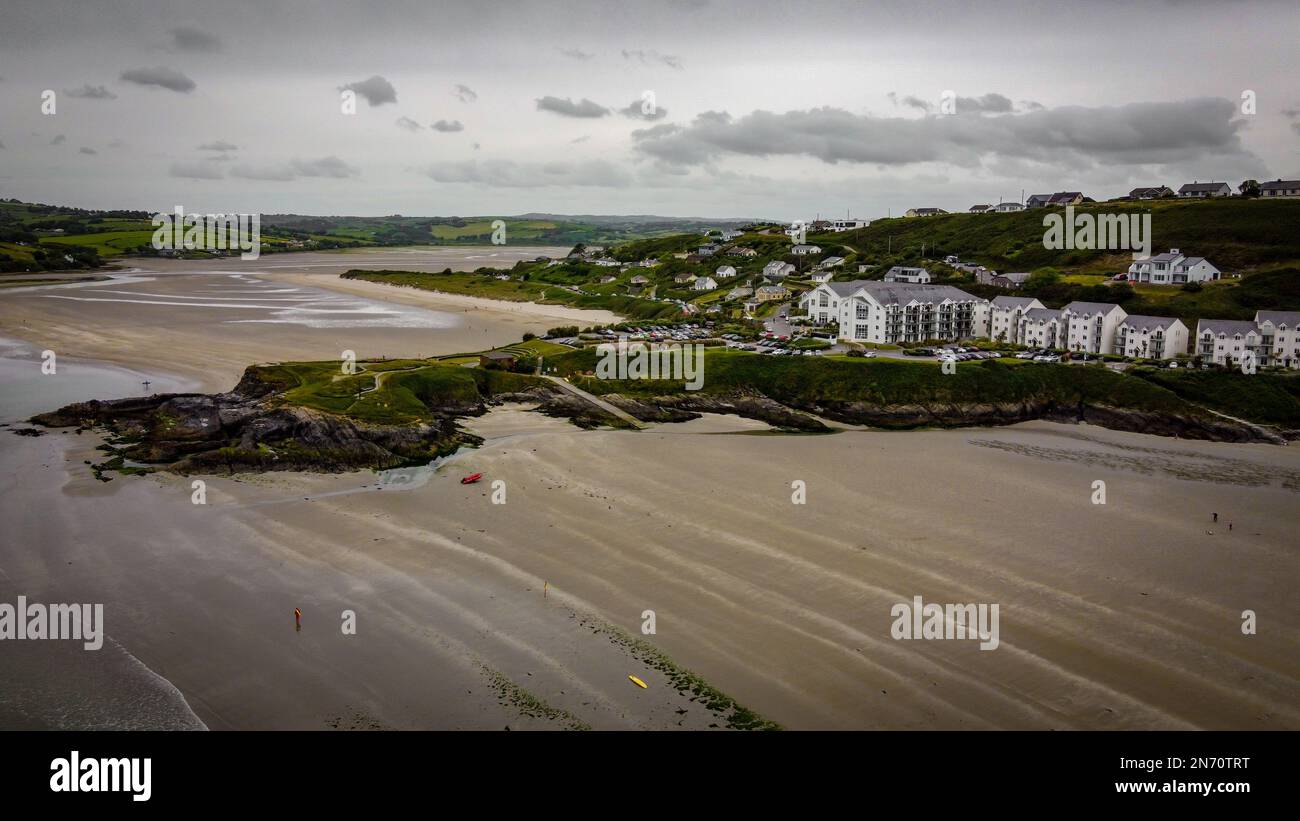 Grey sky over Inchydoney beach and Cape Virgin Mary on a summer day ...