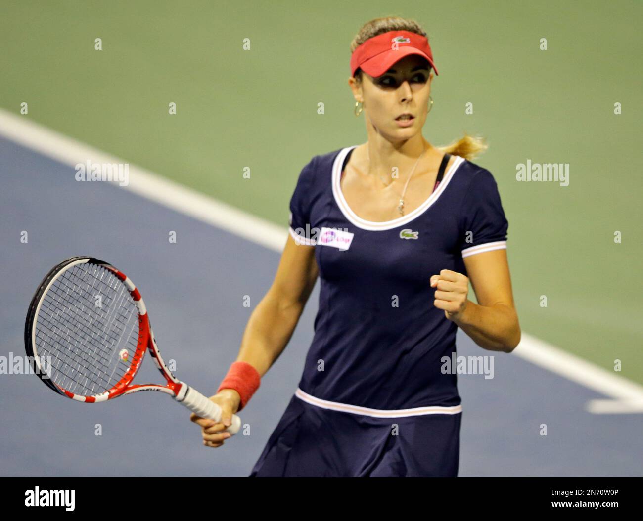 Alize Cornet, from France, celebrates after a point during her match ...