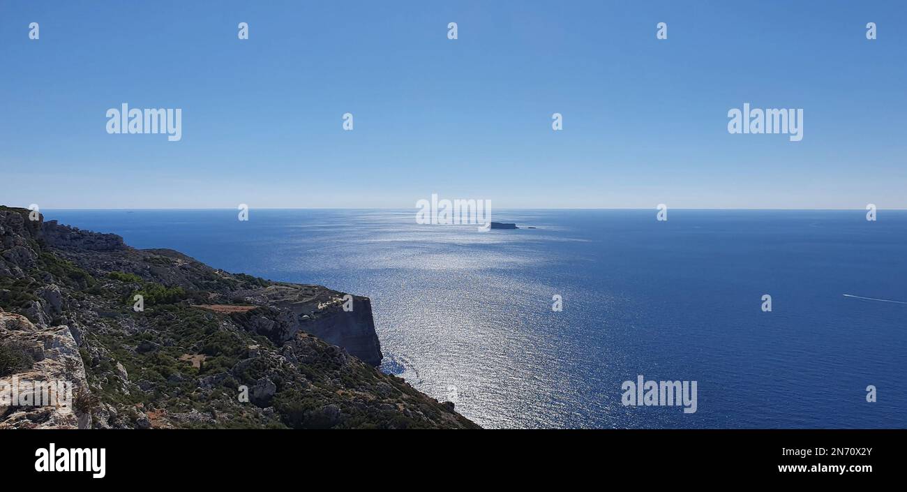 The aerial view of the blue sea with Shark island in the distance ...