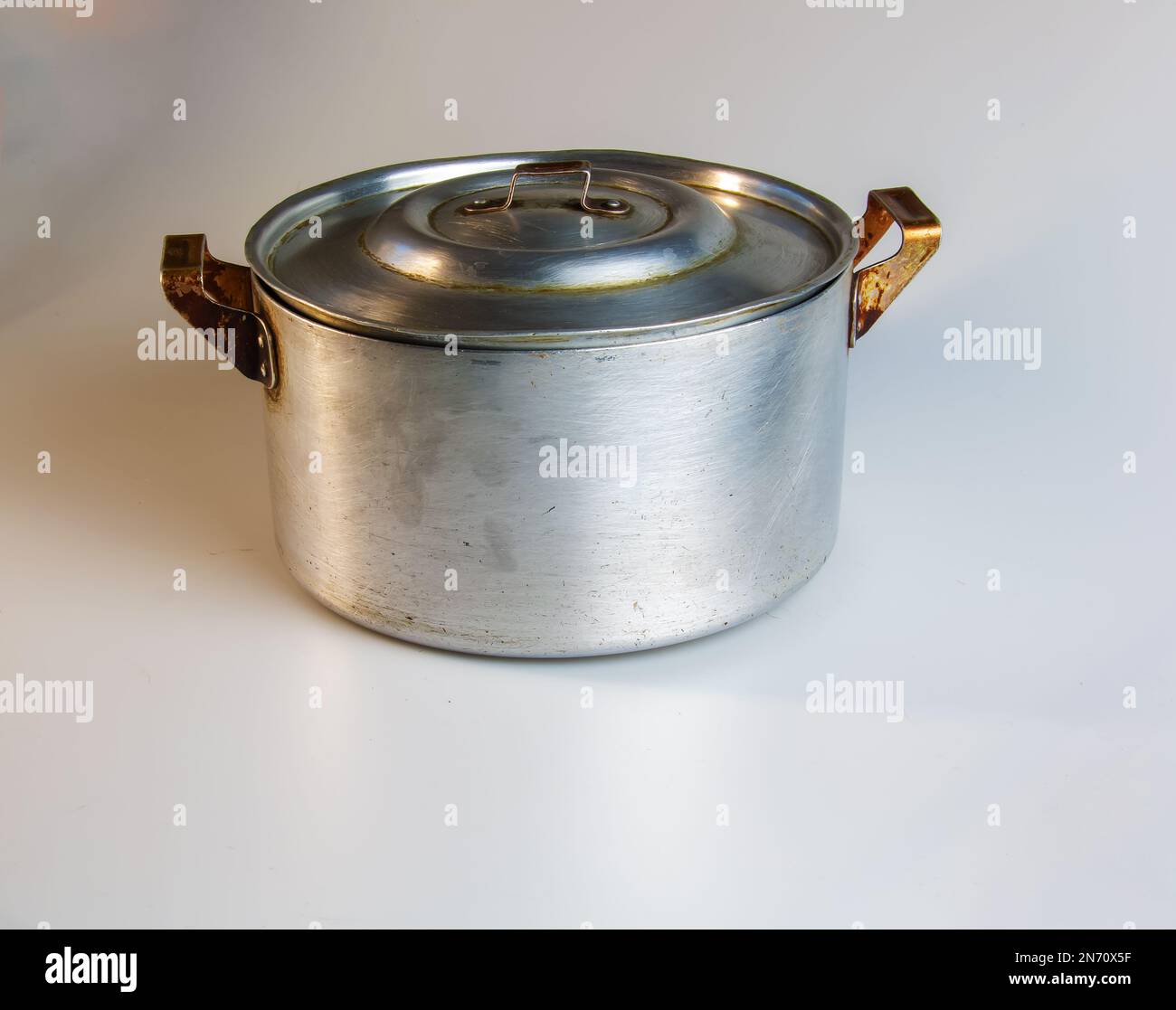 An old aluminum pan made in circa 1960 against a white background Stock ...