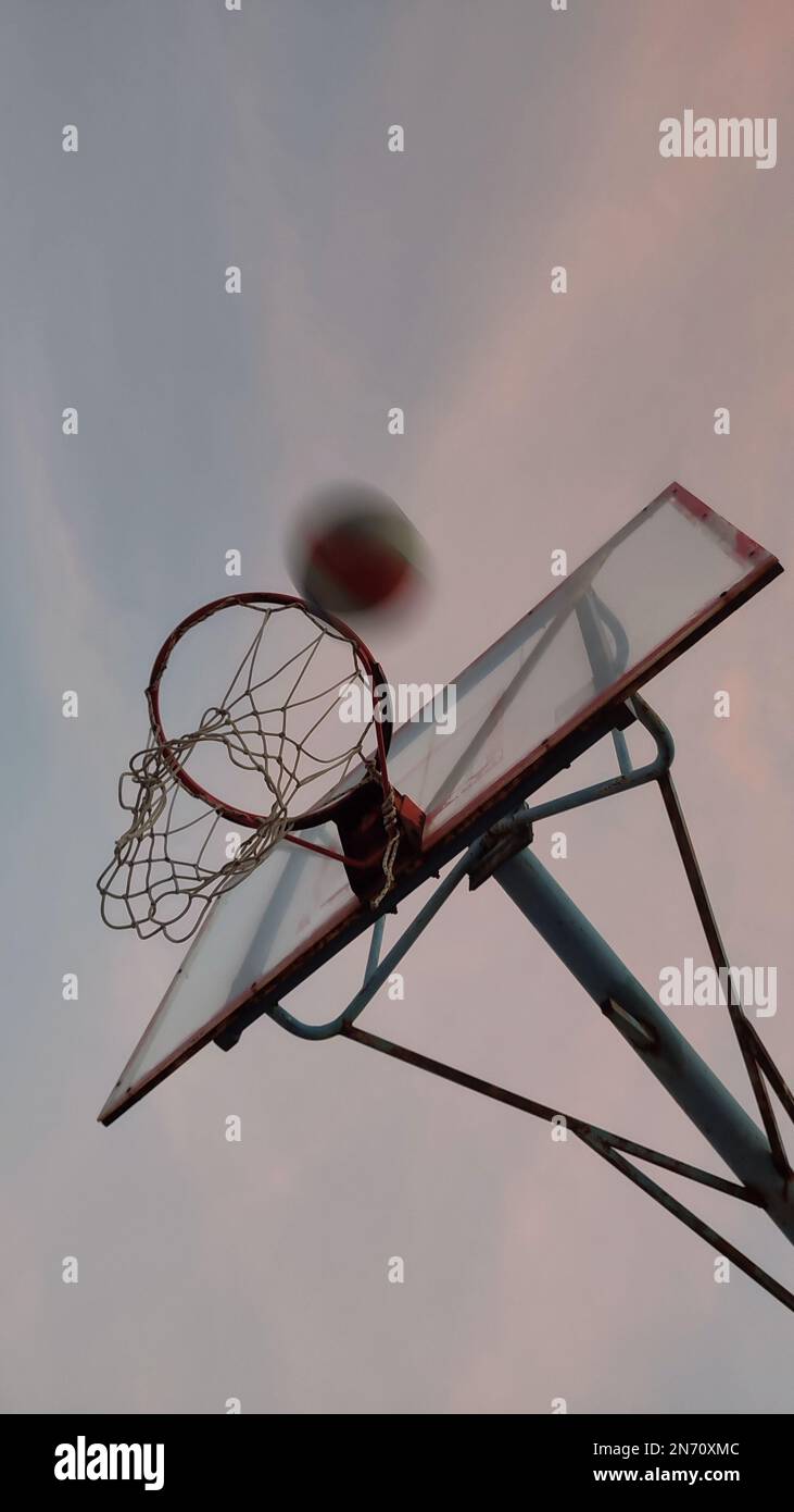 A basketball ball entering the basket Stock Photo - Alamy