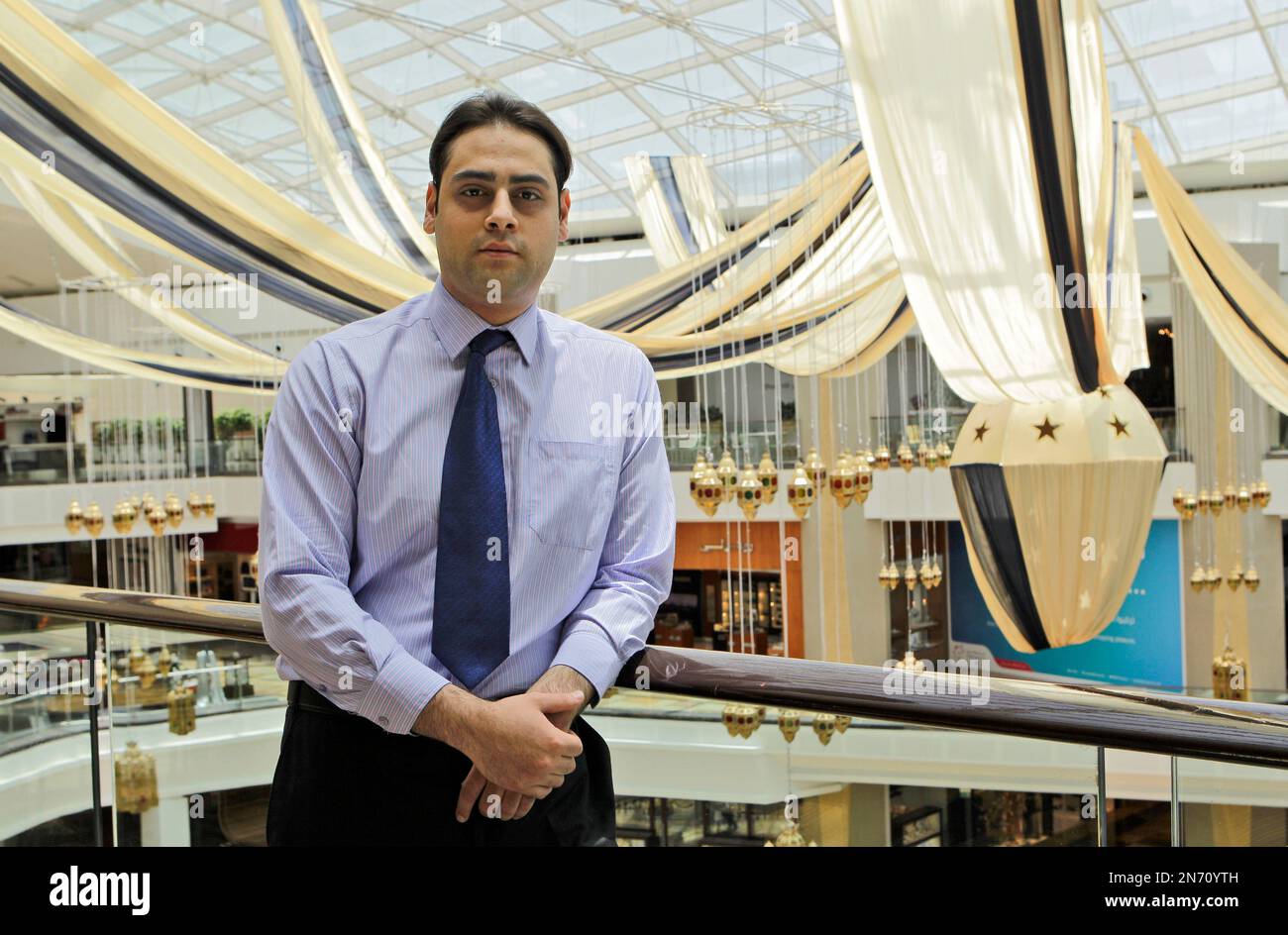 Rafat Awad, a 23 year old pharmacist, poses for a portrait at a ...