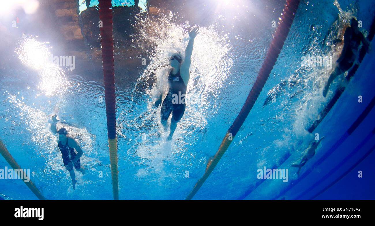Katie Ledecky of the United States, centre, swims to the gold medal in ...