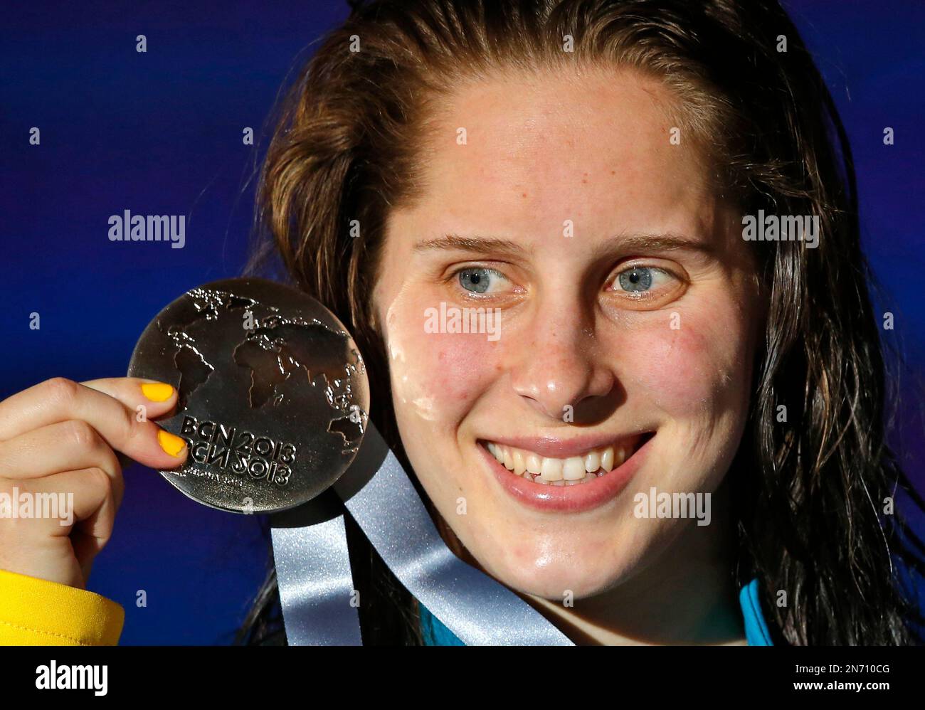 Australia's Belinda Hocking smiles as she holds the silver medal she ...