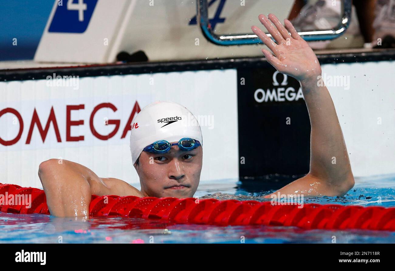 China's Sun Yang waves after finishing a Men's 1500m freestyle heat at ...