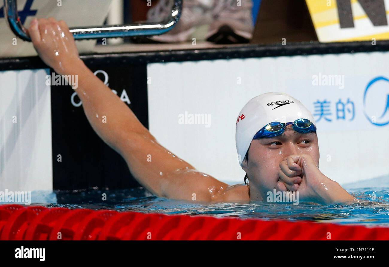 China's Sun Yang rests after finishing a Men's 1500m freestyle heat at ...