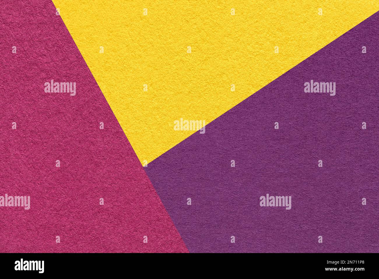 Texture of craft yellow, purple and violet shade color paper background ...