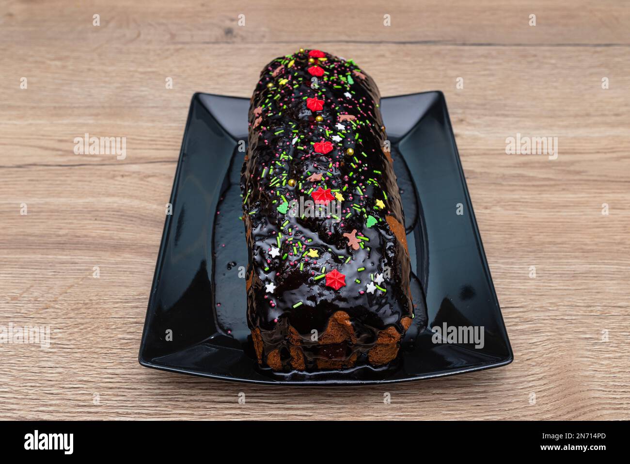 Gingerbread cake with chocolate icing and jam inside, sprinkled with ...