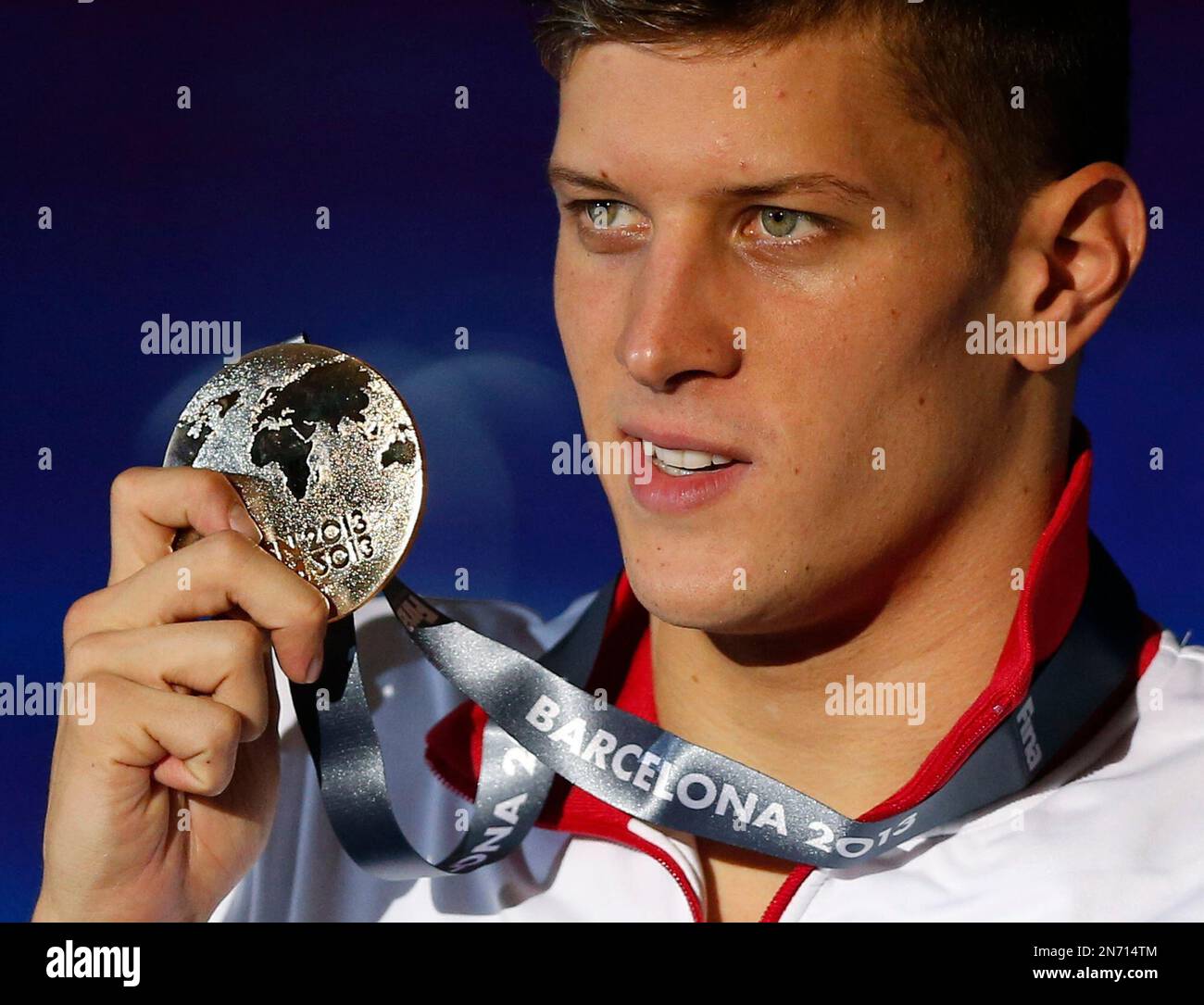 Hungary's Daniel Gyurta holds the gold medal he won in the Men's 200m ...