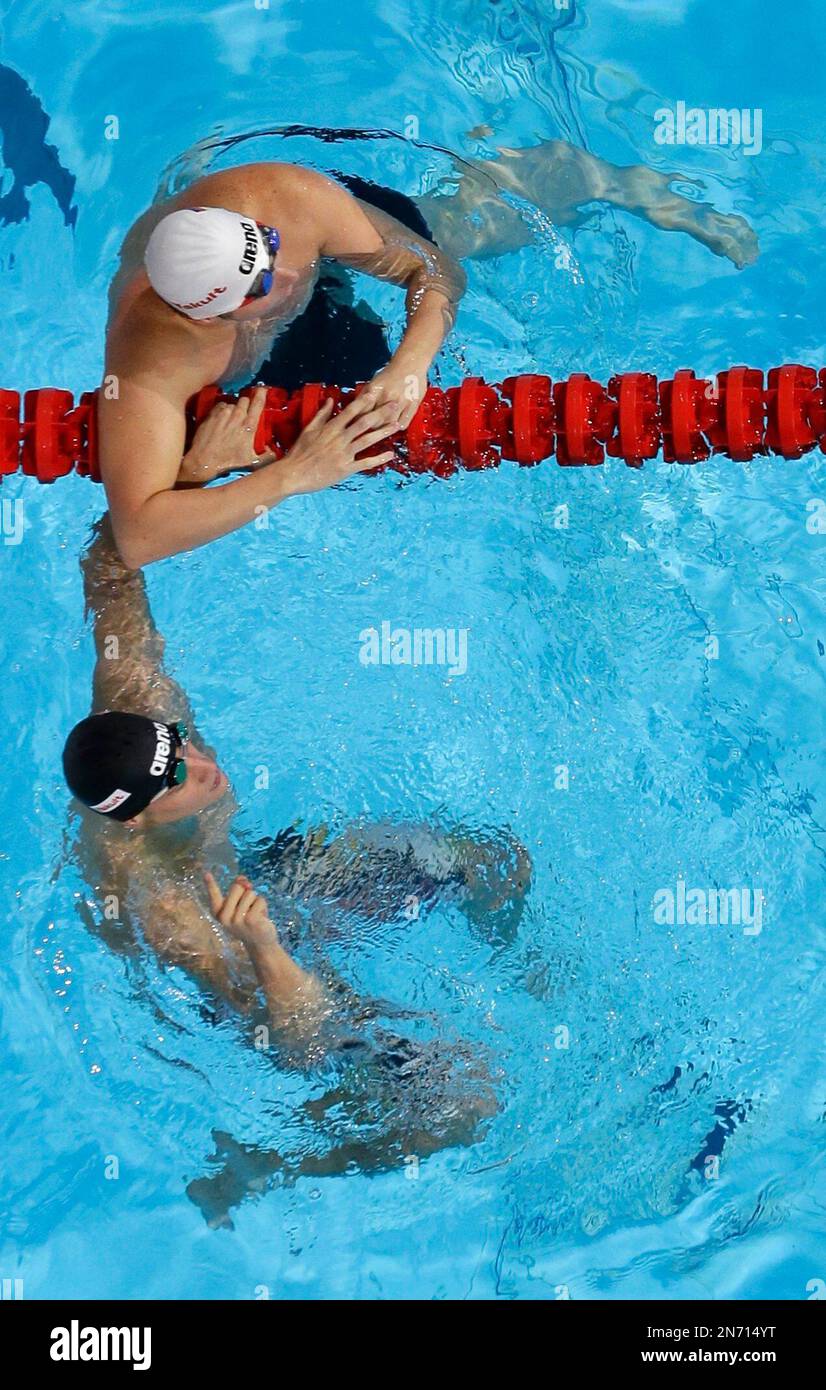 Hungary's Daniel Gyurta, bottom, reacts after winning the gold in the ...