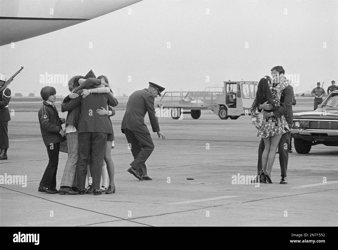 Brig. Gen. Ralph Saunders, 60th MAC Wing Commander, reaches down to ...