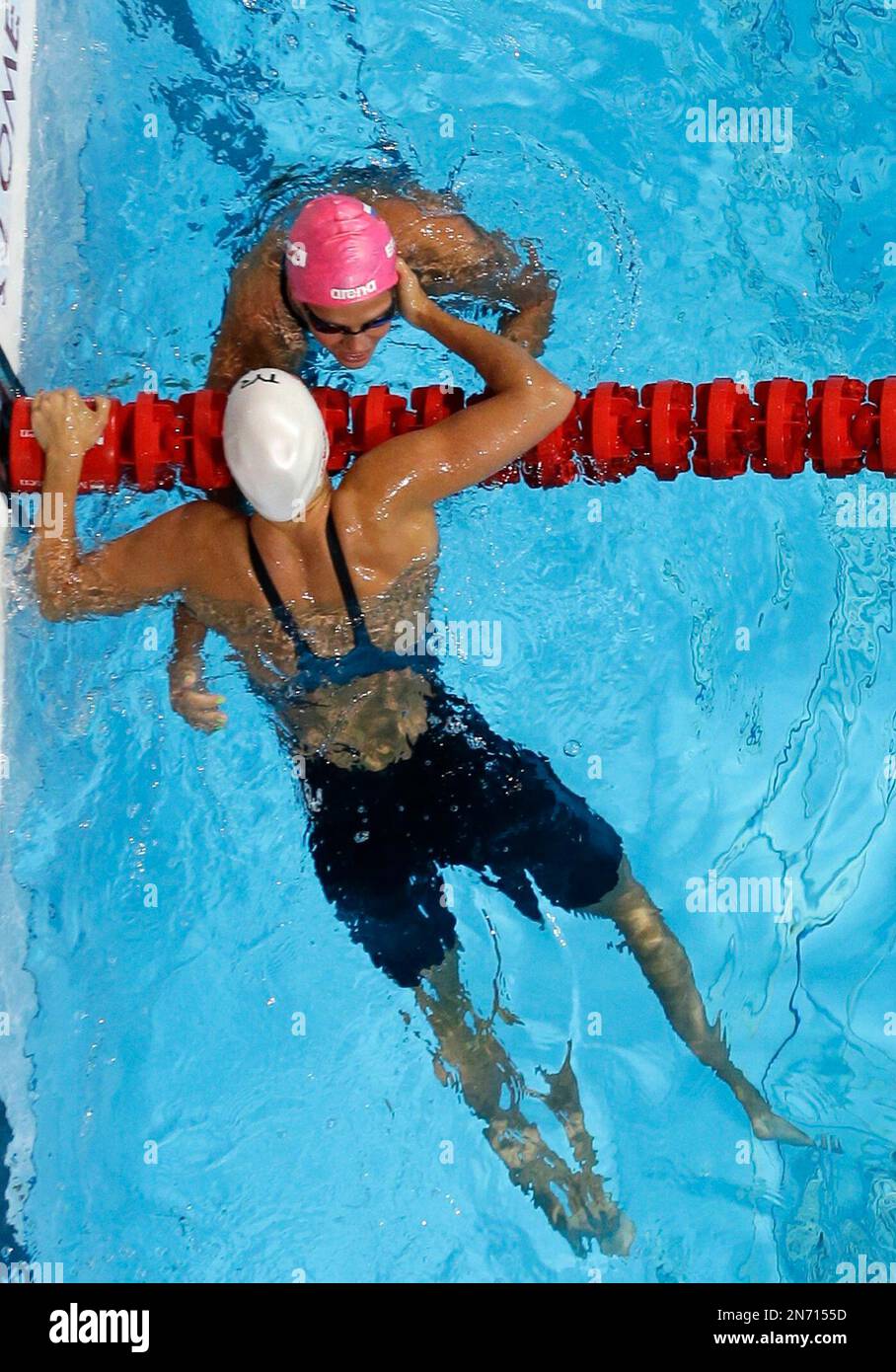 Russia's Yuliya Efimova, top, the gold medalist is embraced by Denmark ...