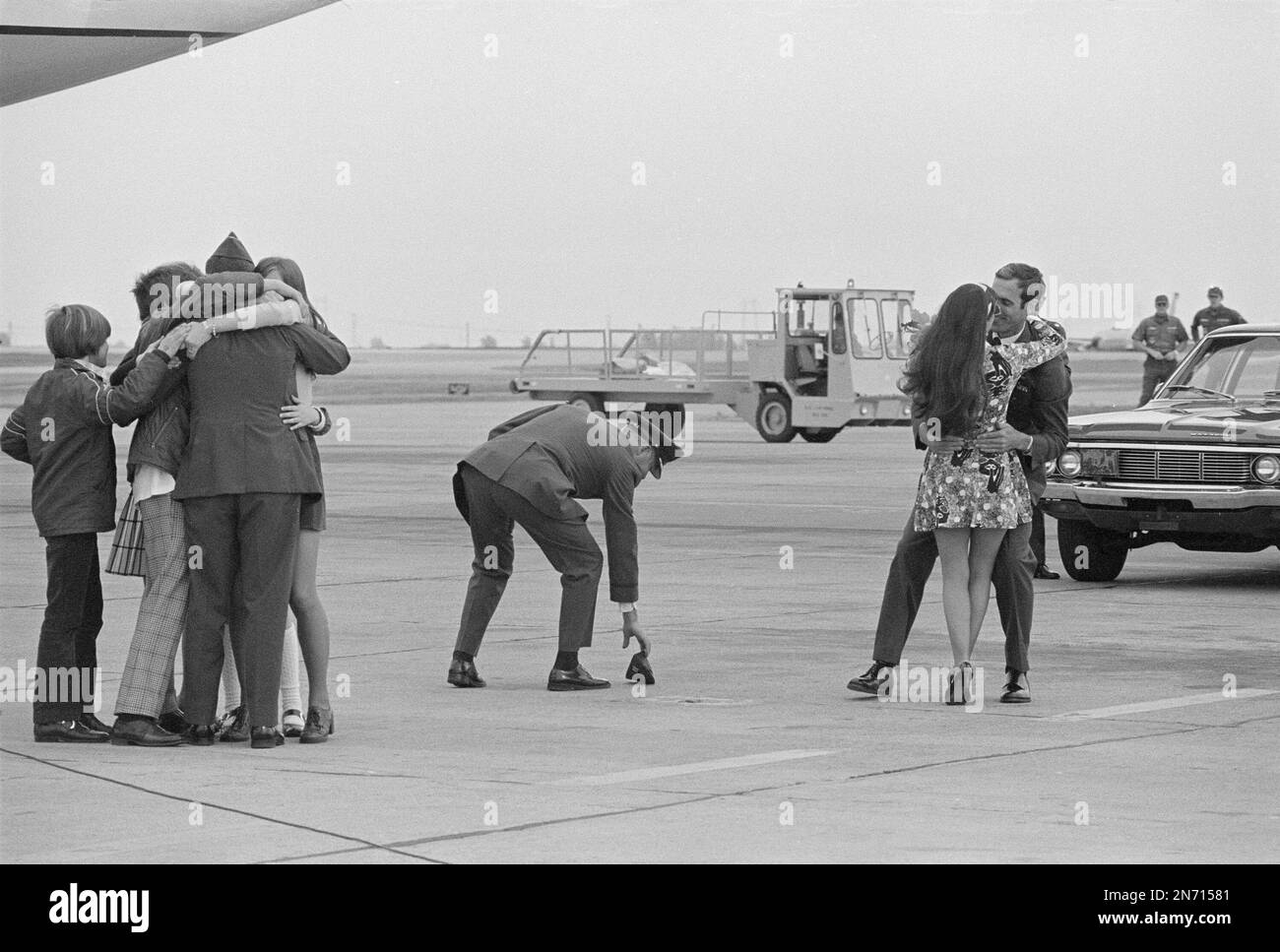 Brig. Gen. Ralph Saunders, 60th MAC Wing Commander, reaches down to ...