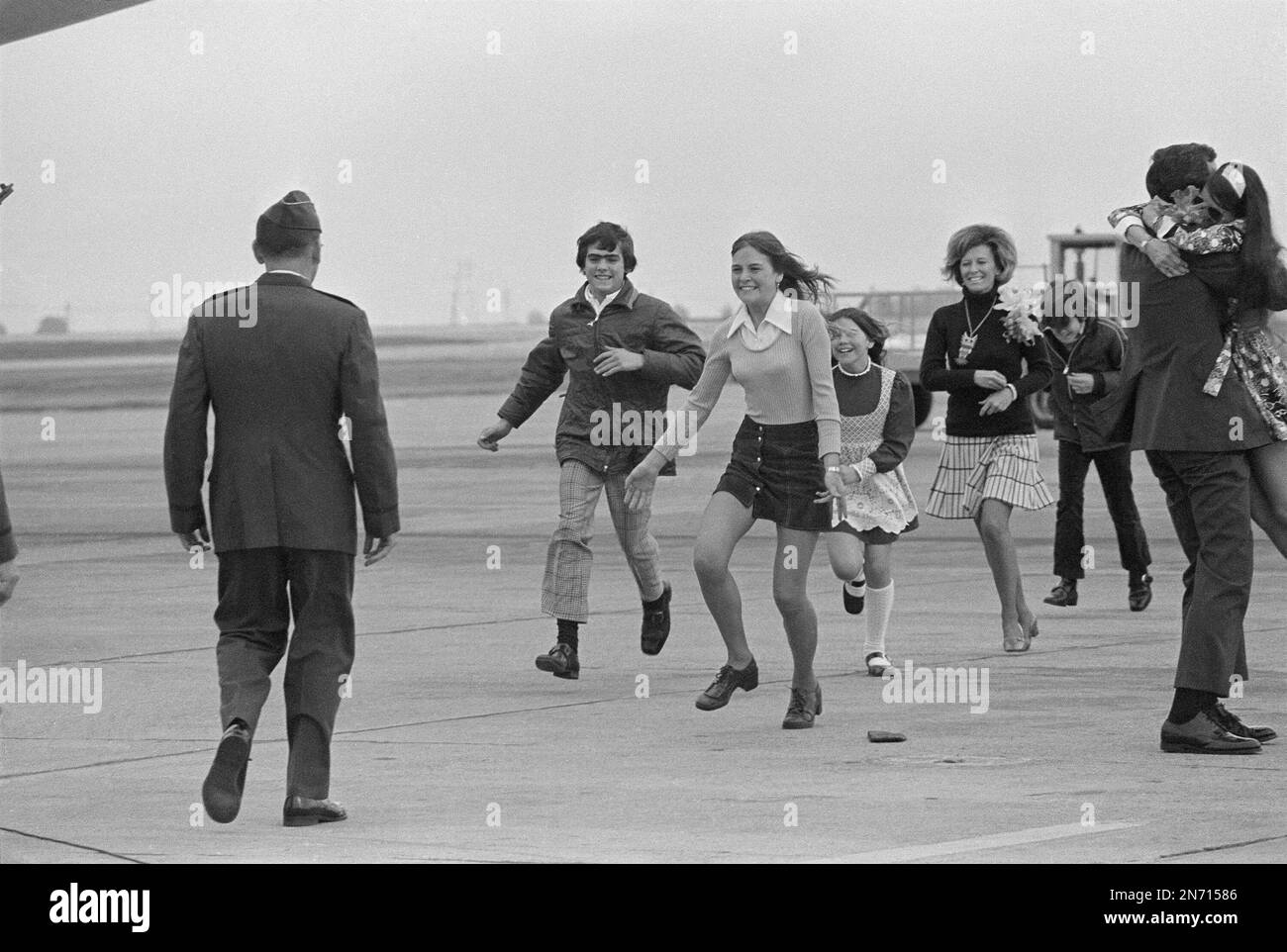 Former POW Capt. Carl D. Chambers, far right, of Yuba City, is greeted ...