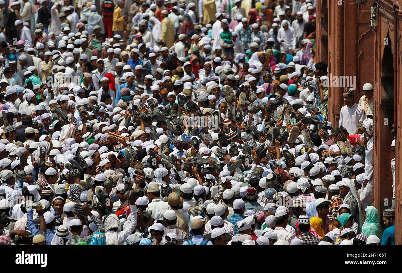 Indian Muslims crowd the gate as they leave Jama Masjid, or the Grand ...