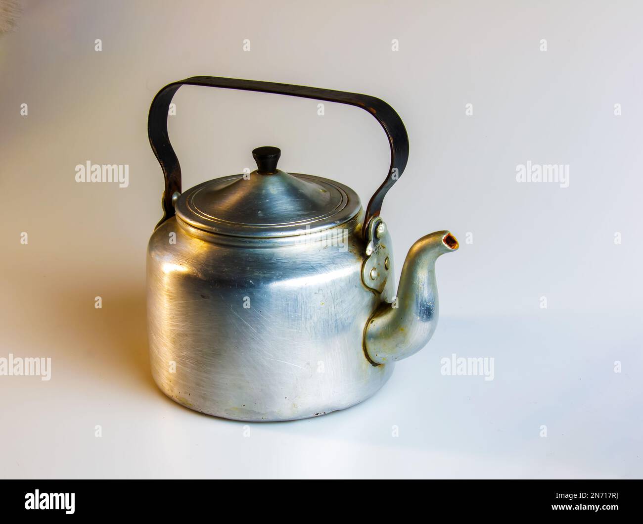 Old soldier's aluminum teapot from the Second World War on a white ...
