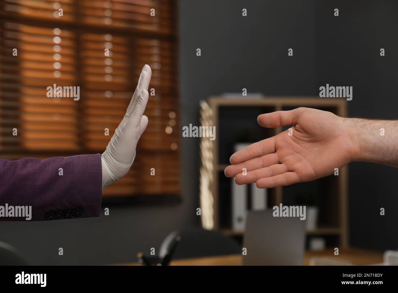 Woman refusing handshake from coworker in office, closeup Stock Photo ...