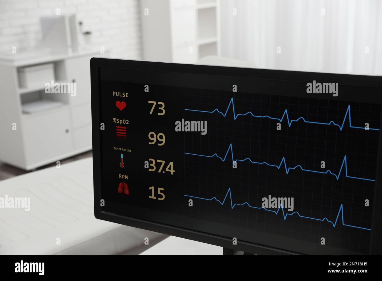 Monitor with cardiogram and data in hospital Stock Photo - Alamy