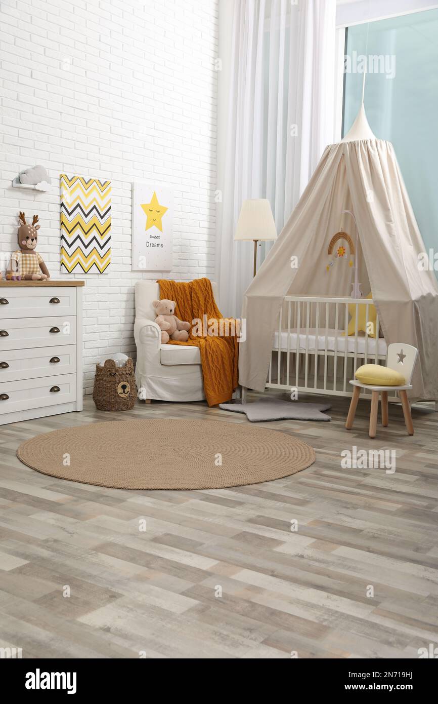 Stylish baby's room with comfortable cot. Interior design Stock Photo ...