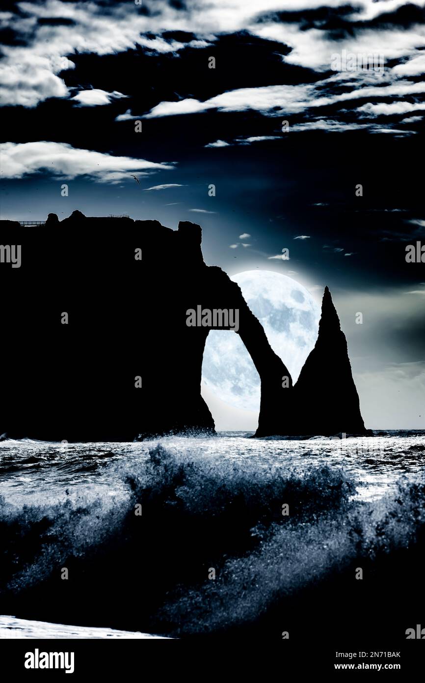 Rock formation in sea under full moon hi-res stock photography and ...